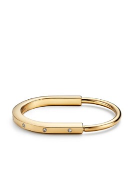 Tiffany & Co. Tiffany Lock bangle van 18 karaat geelgoud met diamanten ...