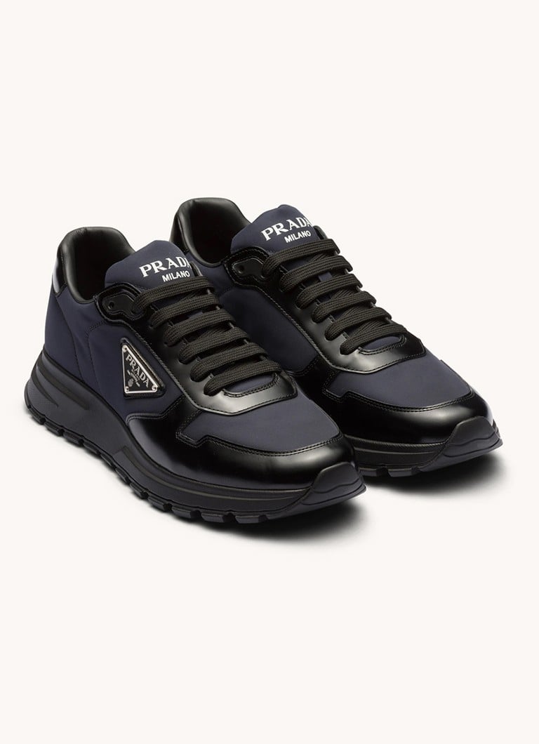 Prada Prax 01 Re-Nylon sneakers met leren details en logo • Donkerblauw • de Bijenkorf