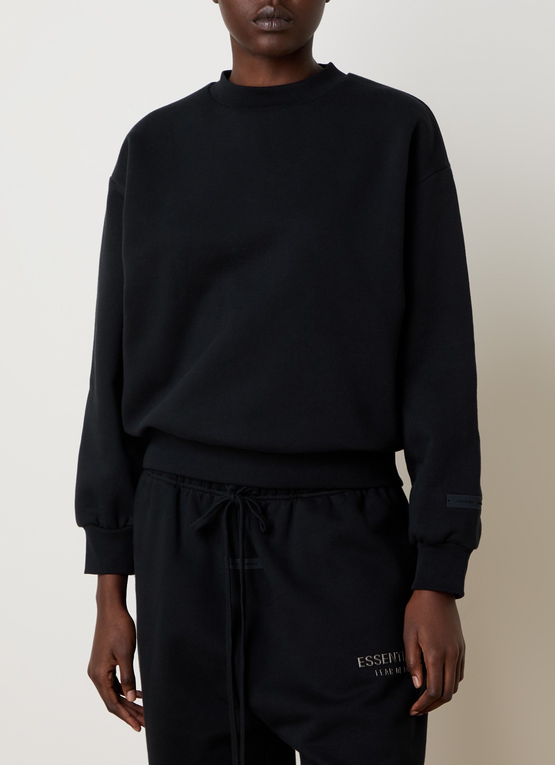 Fear of God Essentials Sweater met backprint • Zwart • de Bijenkorf